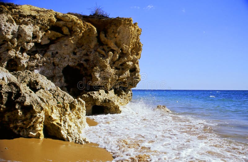 Beach cliff stock image. Image of cliff, splashes, algarve - 104127