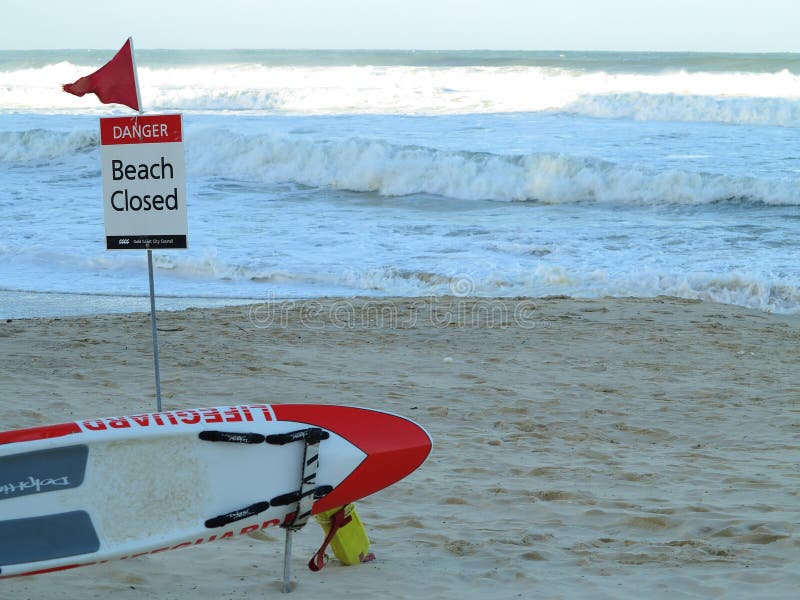 Beach Closed Sign and Lifeguard Surfboard by Waves Editorial Stock ...