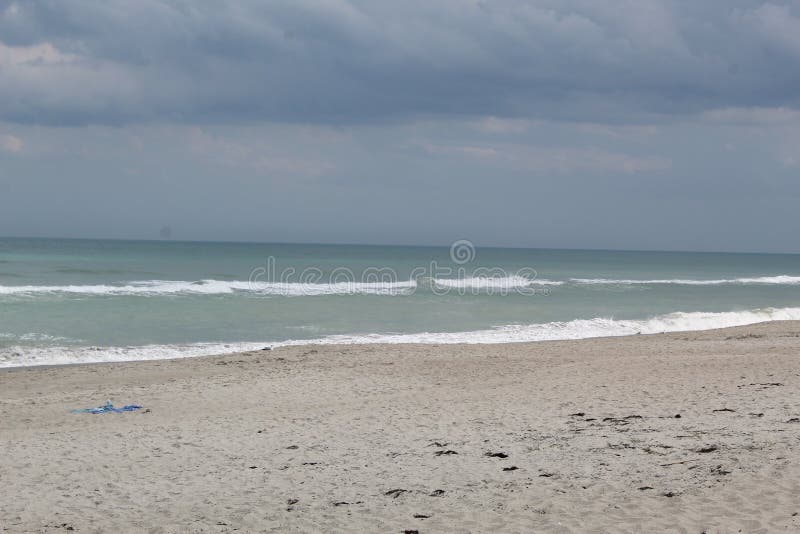 Beach on a cloudy day stock image. Image of ocean, vacation - 210427447