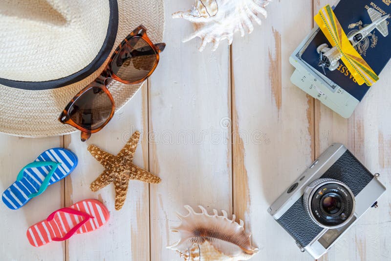Beach Composition with Straw Hat, Camera, Shells and Starfish on White ...