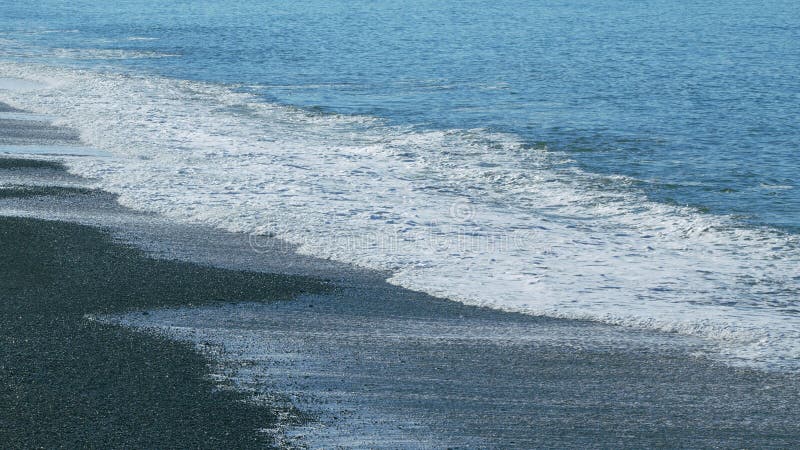 Beach is Covered with Pebble. Small Sea Waves. Waves Crashing on a ...