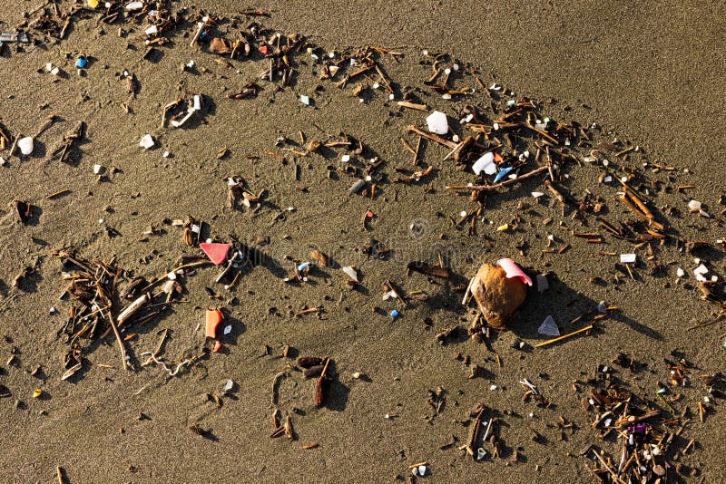 A Beach Covered in Trash and Debris Stock Photo - Image of material ...