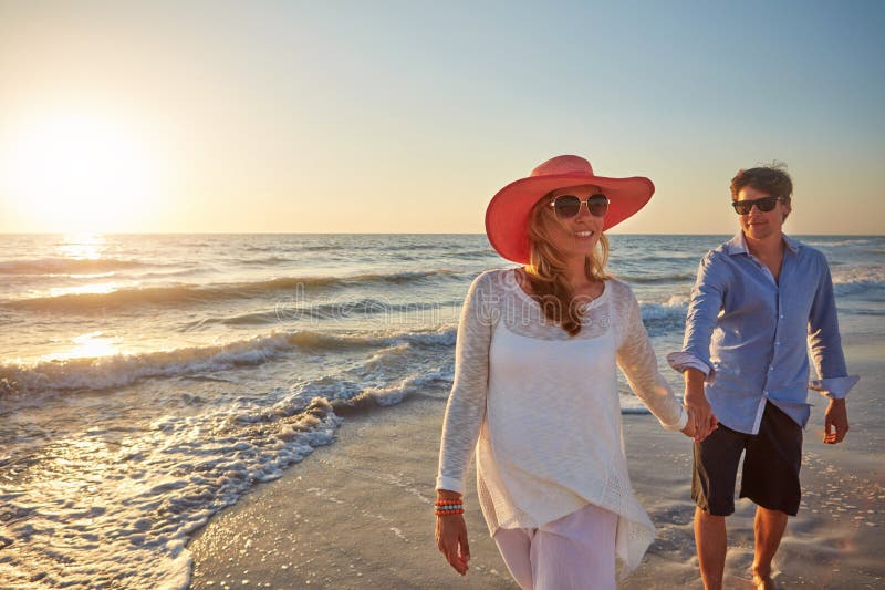 Beach Dates are the Best. a Happy Couple Walking on the Beach. Stock ...