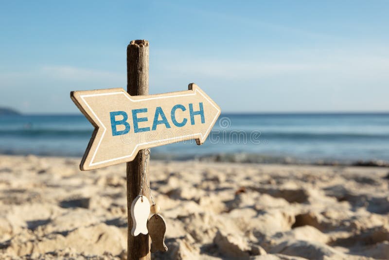 Beach Directional Sign Pole on Sandy Beach Stock Photo - Image of ...