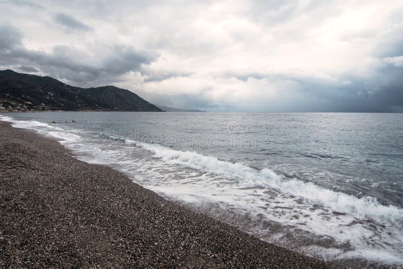 Beach in a Dramatic Atmosphere Stock Image - Image of dramatic, rocks ...