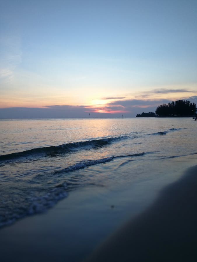 The beach at dusk. stock photo. Image of waves, mild - 102252900