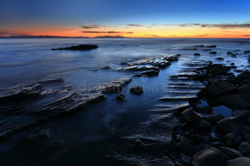 Beach at Dusk stock image. Image of mountains, park, beach - 63483919