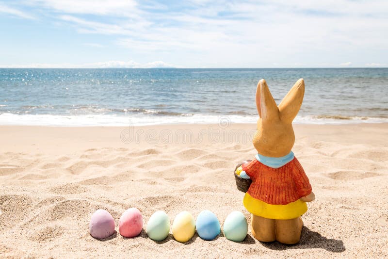 Easter Bunny With Colorful Easter Eggs On A Beach Stock Image - Image ...
