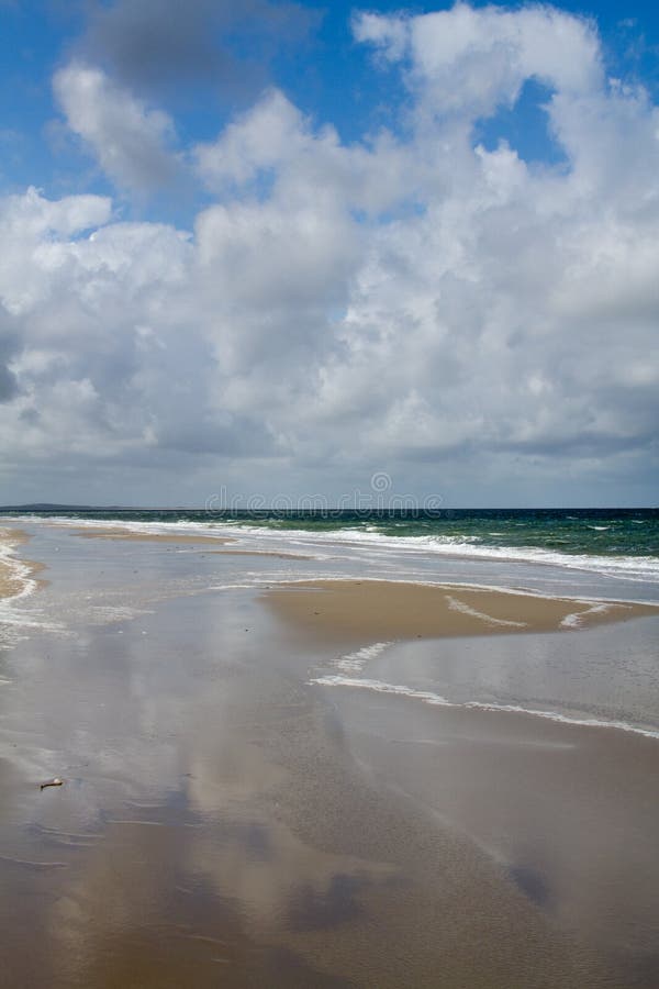 Beach at ebb tide stock photo. Image of reflected, left - 99607820