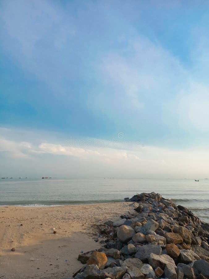 Beach Expanse View with Stone and Blue Sky Stock Image - Image of ...