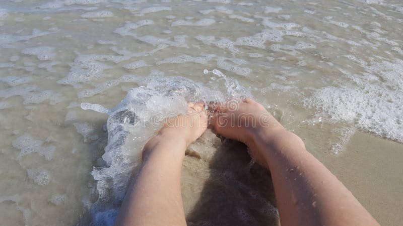 Beach Feet stock photo. Image of beach, surf, feet, ocean - 83293614