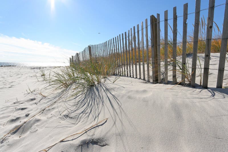 Beach fence stock photo. Image of dune, peaceful, clouds - 3714396