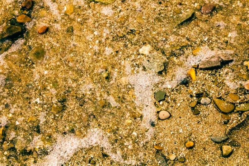 A Beach Filled with Rocks, Sand, and Broken Shells in Geneva-on-the ...