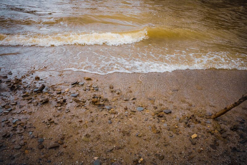 A Beach Filled with Rocks, Sand, and Broken Shells in Geneva-on-the ...