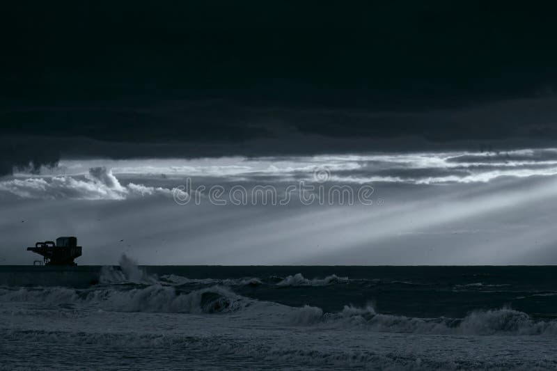 Beach in the Foreground with a Structure in the Distance Across the Sea ...