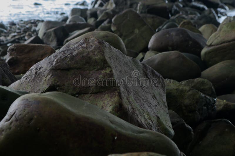 The Beach is Full of Rocks and Waves Stock Image - Image of statue ...