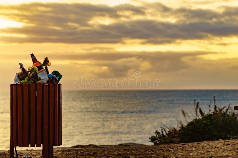 Beach with Garbage Bin Full of Trash Stock Photo - Image of seaside ...