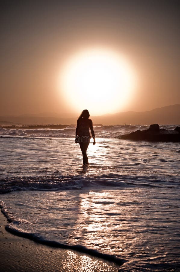 Beach girl at sunset stock image. Image of solitude, walking - 21061209