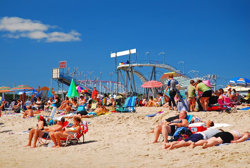 Beach Goers Angle Themselves To Catch the Sun`s Rays Editorial ...