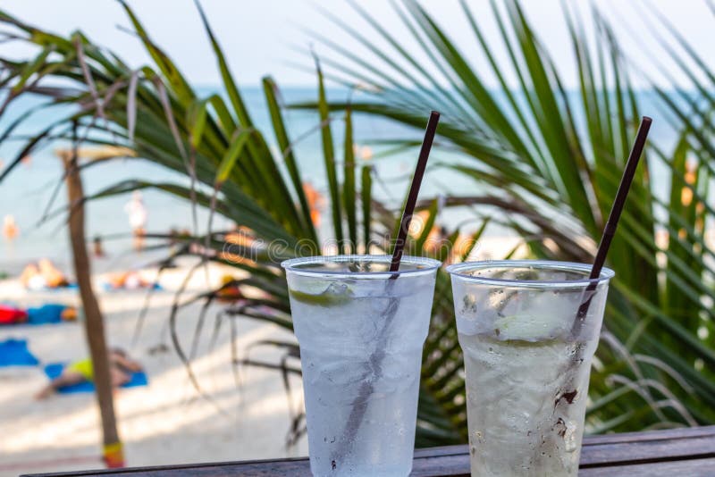 Beach happy hour drinks stock image. Image of beach - 153746111