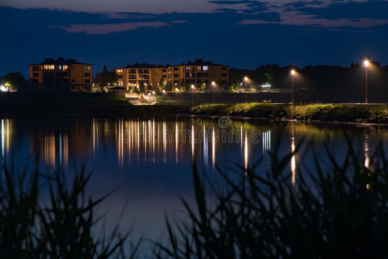 Beach Houses at Night, Reflected Light in the Water from Residential ...