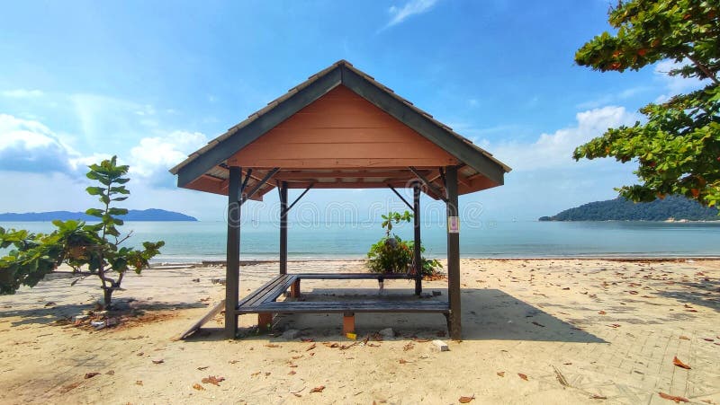 Beach Hut with Sea and Tree Views Stock Photo - Image of sand, shore ...