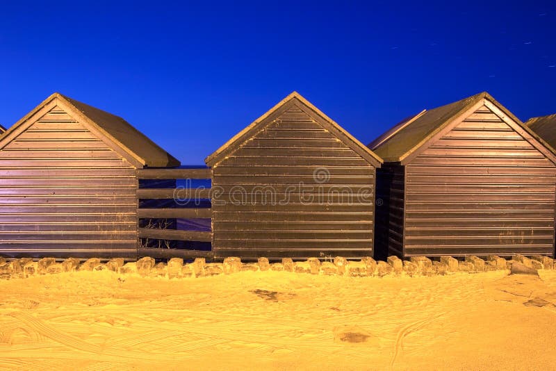 Beach huts at night stock image. Image of night, beautiful - 64703693