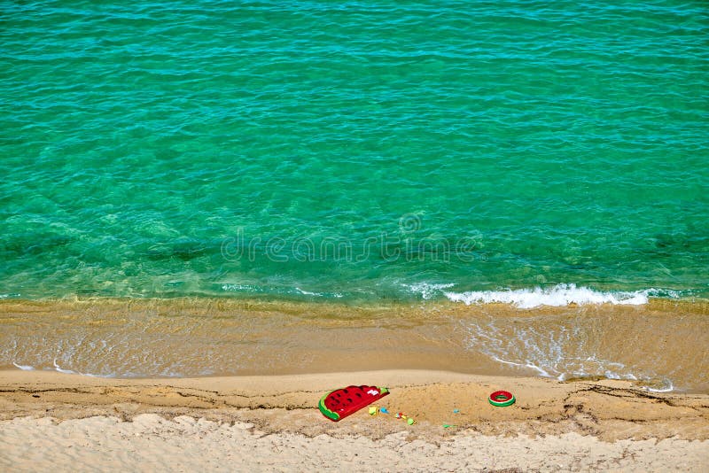 Beach with Inflatable Float and Ring Stock Photo - Image of tropical ...