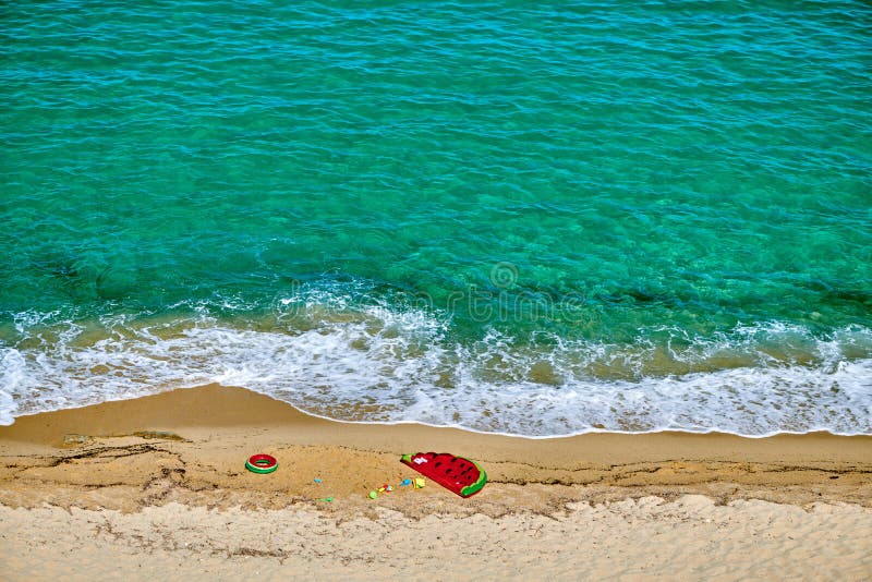 Beach with Inflatable Float and Ring Stock Photo - Image of tide ...