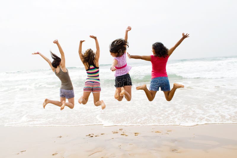Beach jump stock photo. Image of four, games, joyful - 10972442