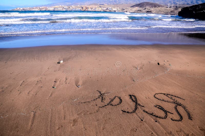 A Beach with a Large Body of Water in the Background Stock Photo ...