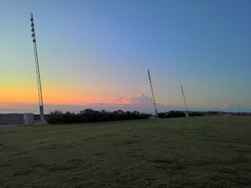 Beach light poles stock photo. Image of field, clear - 100051230