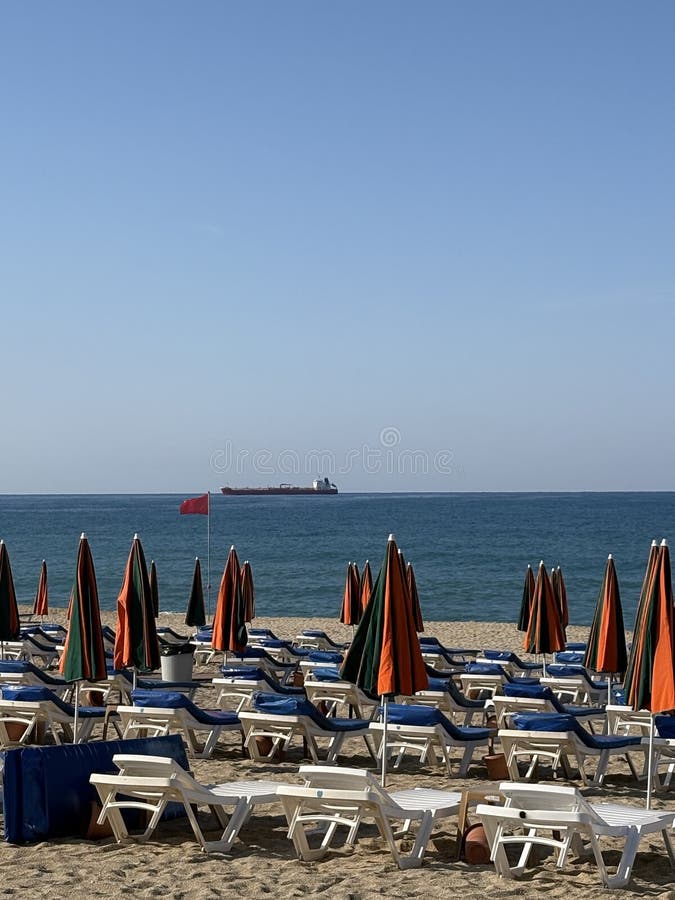 Beach lounge chairs stock image. Image of landscape - 379009443