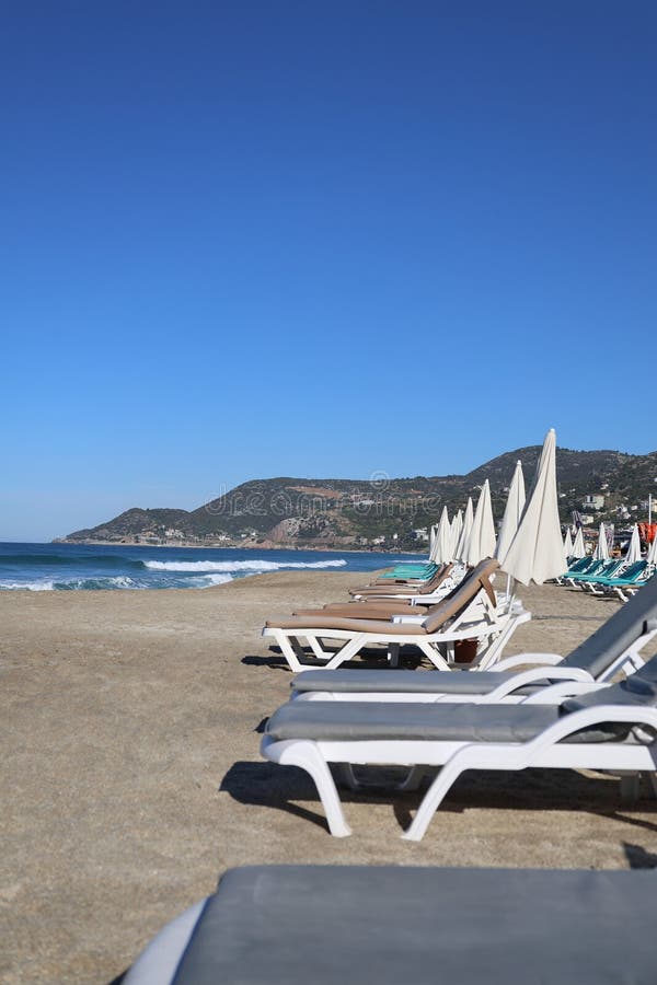 Beach lounge chairs stock image. Image of resort, beach - 379011421