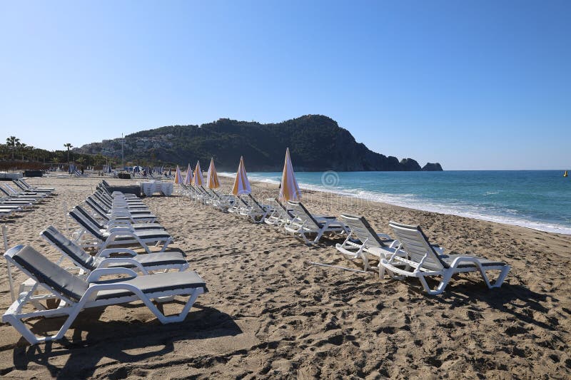 Beach lounge chairs stock photo. Image of loungers, coastline - 379013280