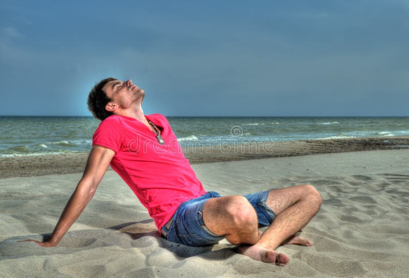 Beach man relaxing stock image. Image of model, sitting - 20374387