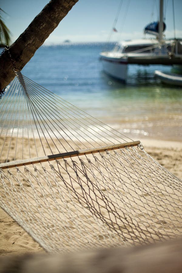 Beach Spot Showing a Hammock and Catamaran Stock Photo - Image of ...