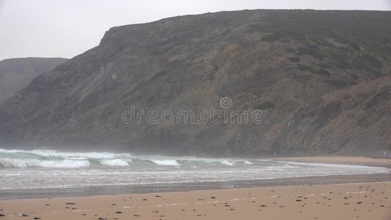 On Beach Near Cliffs stock image. Image of rock, couple - 86048357