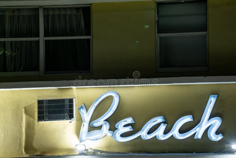 Beach neon sign at night stock photo. Image of miami - 232858938