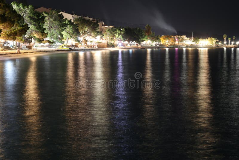 Beach at night stock photo. Image of jakov, illuminated - 202919966