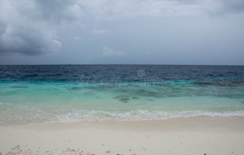 The Beach and Ocean on a Cloudy Day Stock Photo - Image of season ...