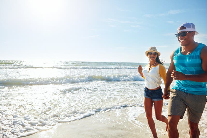 The Beach is Our Happy Place. a Happy Young Couple Taking a Walk on the ...