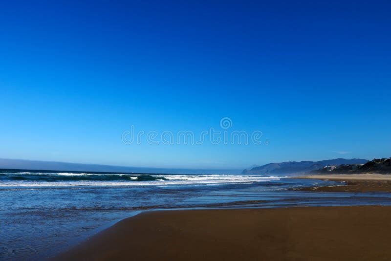 The Beach on the Pacific Ocean on a Sunny Day with a Beautiful Sky ...