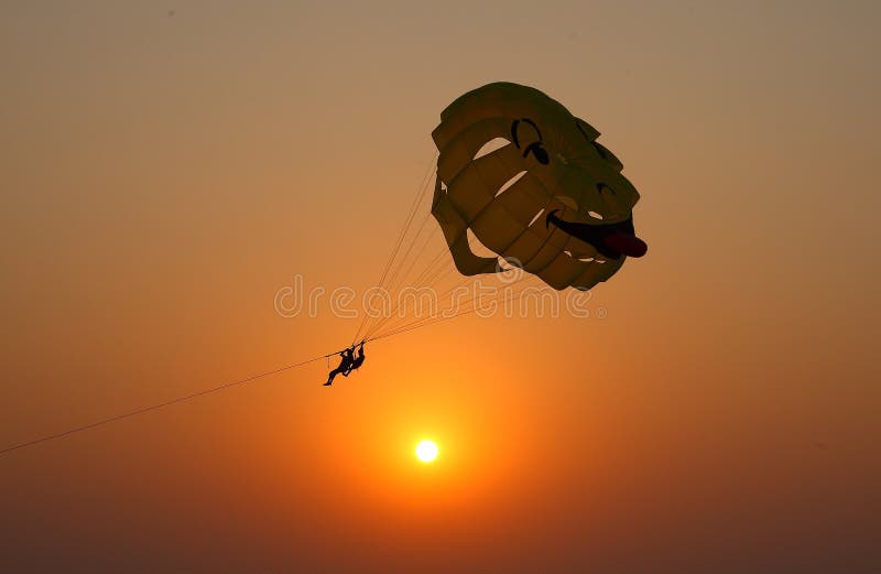 Beach Parachuting. stock image. Image of orange, holiday - 5473115