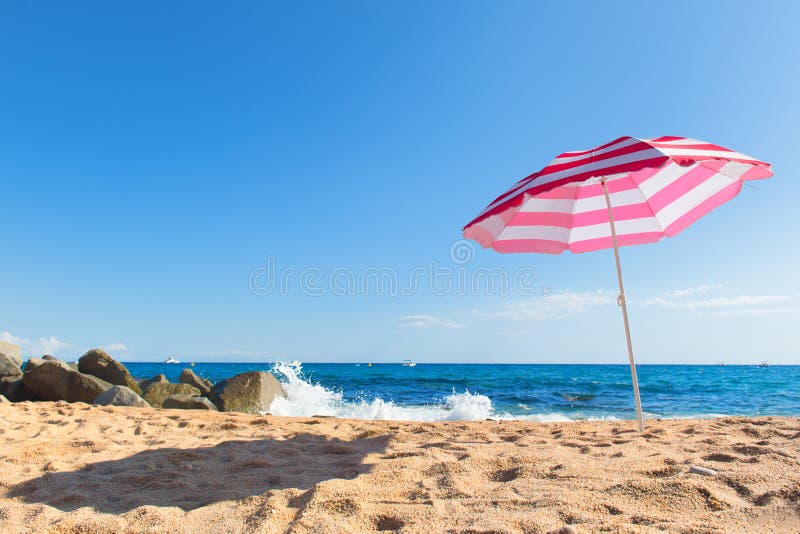 Beach with parasol stock photo. Image of travel, water - 132573370