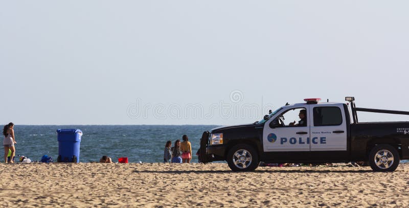 Police patrolling beach editorial photo. Image of sunset - 20614926