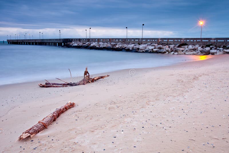 Beach and Pier stock photo. Image of cloud, rock, sand - 13410448