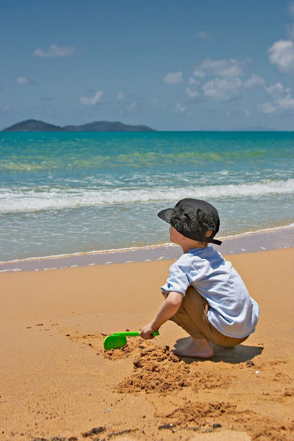 Beach play stock photo. Image of digging, child, sand, sunsmart - 331392