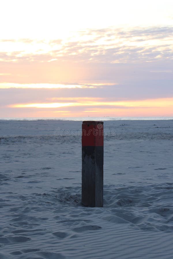 Beach Pole at Sunset stock image. Image of landscape - 196970721