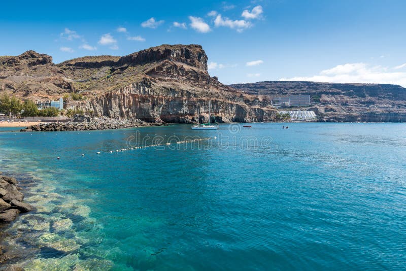 Beach at Puerto Mogan - Playa Mogan Stock Image - Image of mountain ...